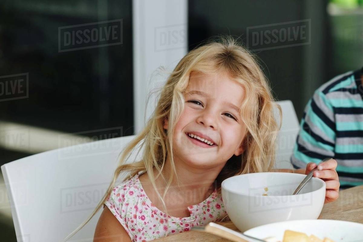 Happy little girl finishing lunch at home - Royalty-free Stock Photo ...
