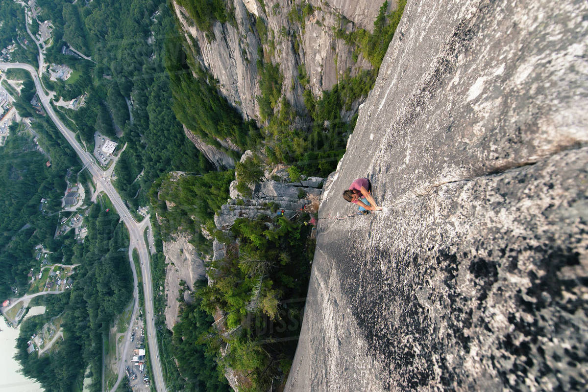 Rock climber with friends climbing Heatwave, on top of The Chief ...