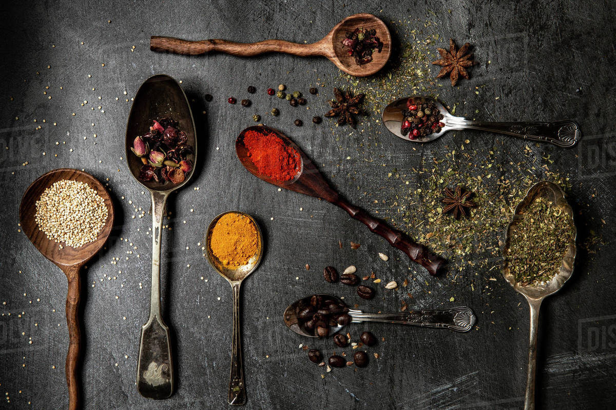 Assortment of spoons with variety of spices and condiments - Royalty ...
