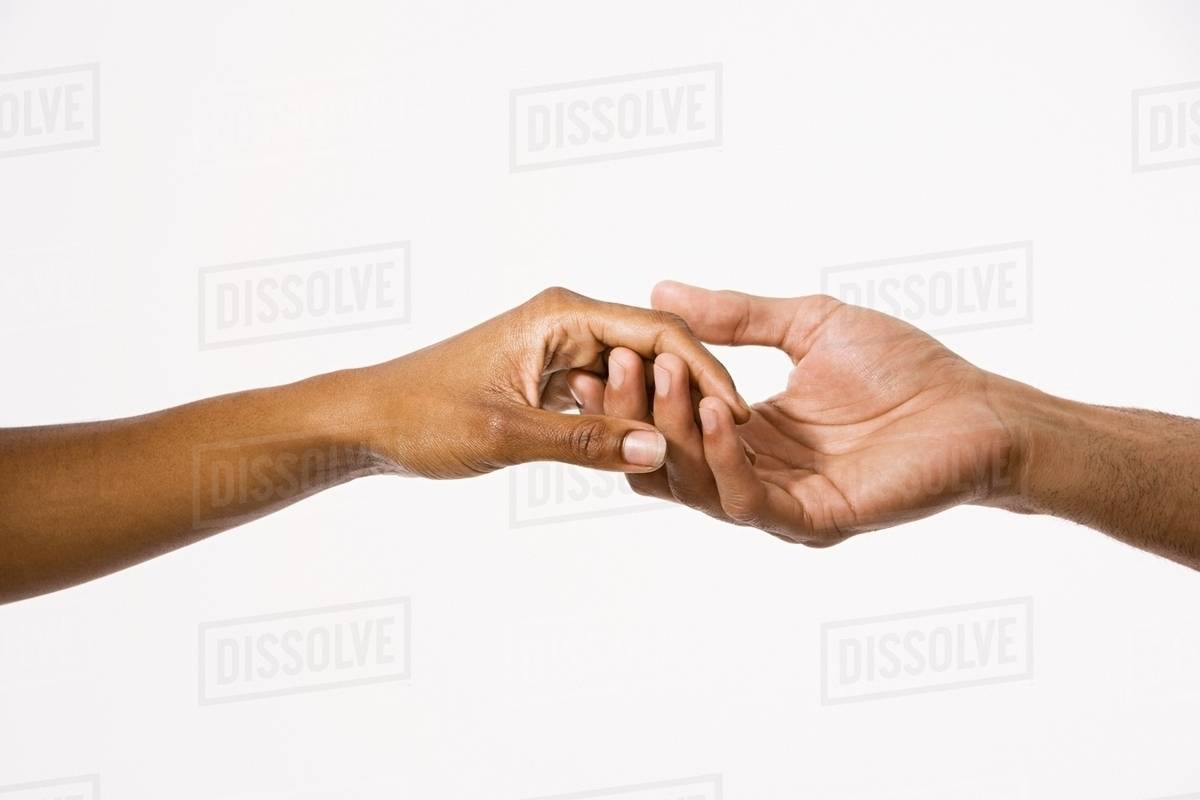 Holding hands - Royalty-free Stock Photo | Dissolve