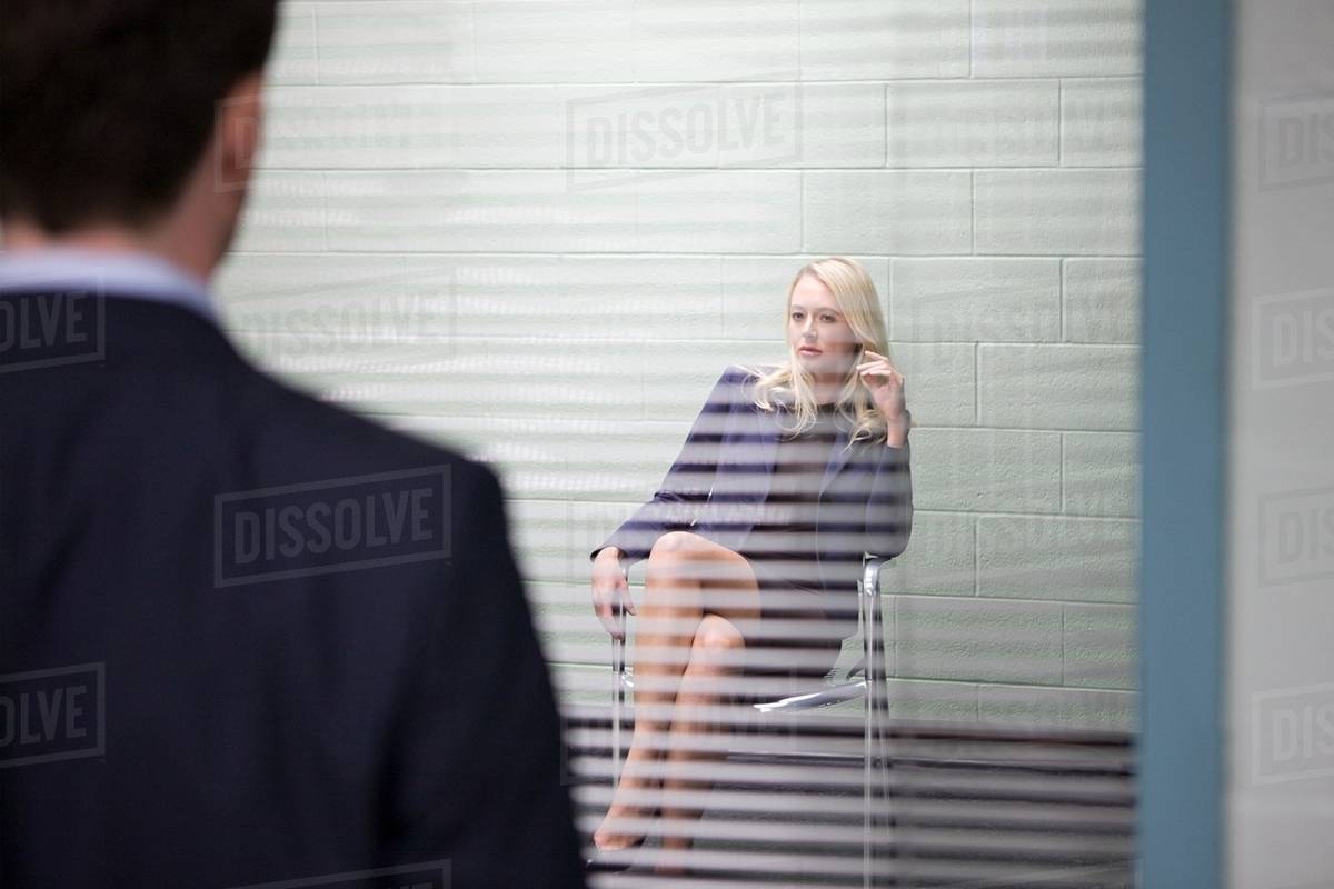 Woman in interview room - Stock Photo - Dissolve