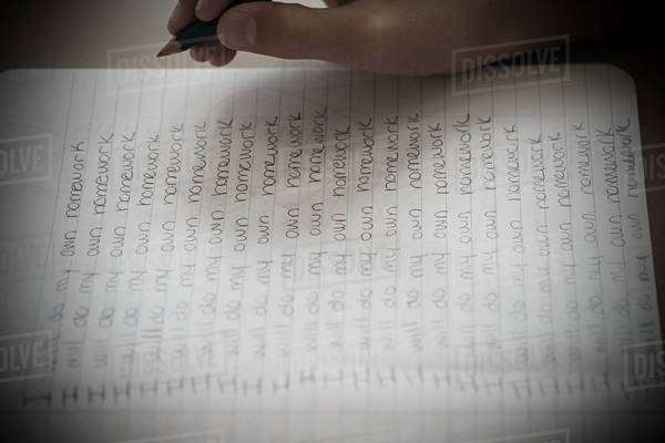 School student writing lines - Royalty-free Stock Photo | Dissolve