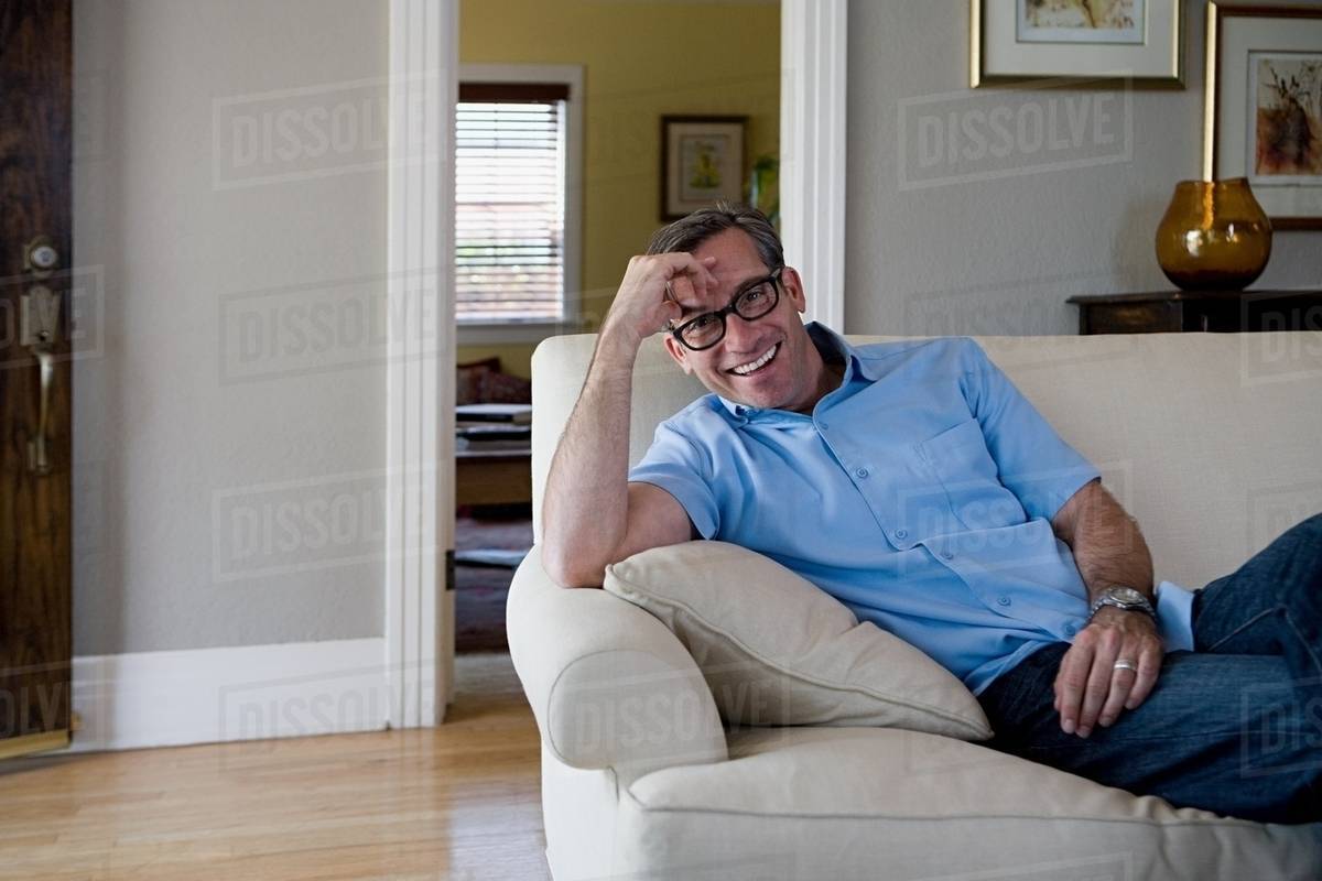 Man on sofa - Stock Photo - Dissolve