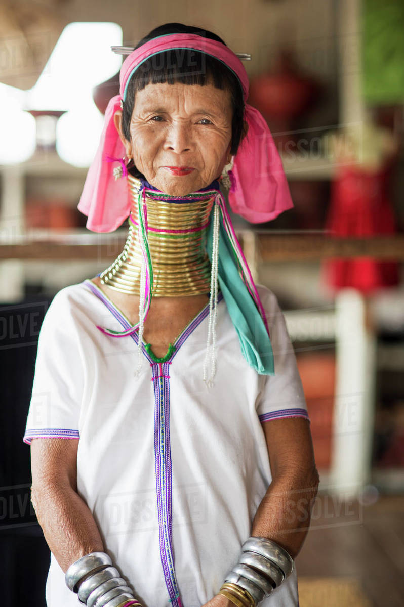 Portrait of mature woman wearing traditional clothing, Inle lake, Burma ...