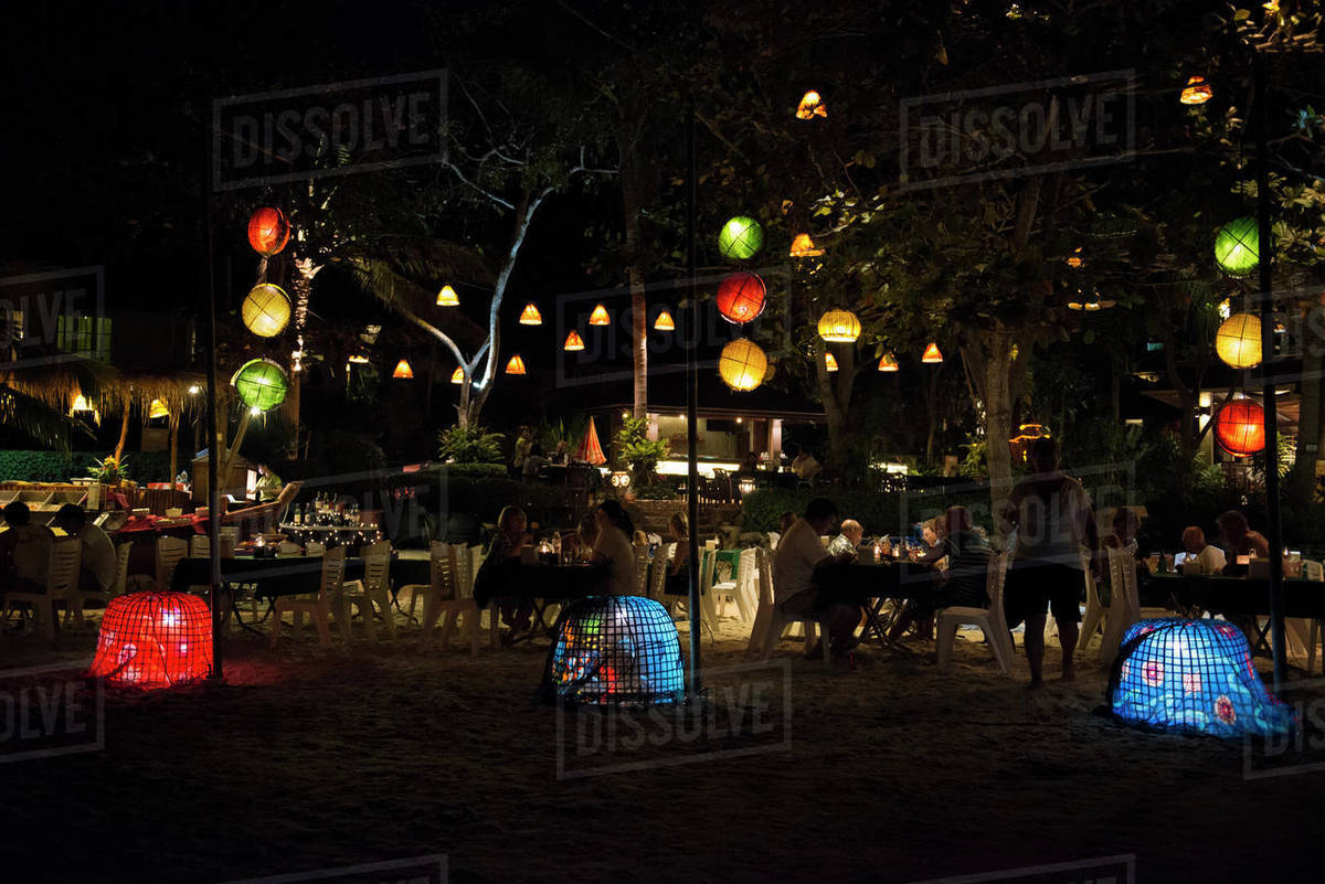 Fairy lights in cafe at night - Stock Photo - Dissolve