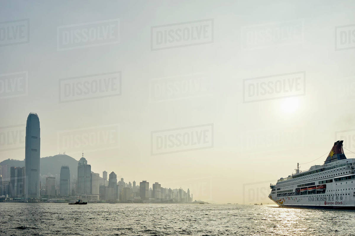 Cruise ship and skyscraper skyline on waterfront, Hong Kong, China ...