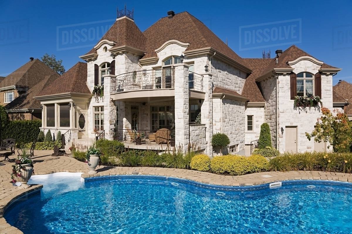Large house with swimming pool - Stock Photo - Dissolve