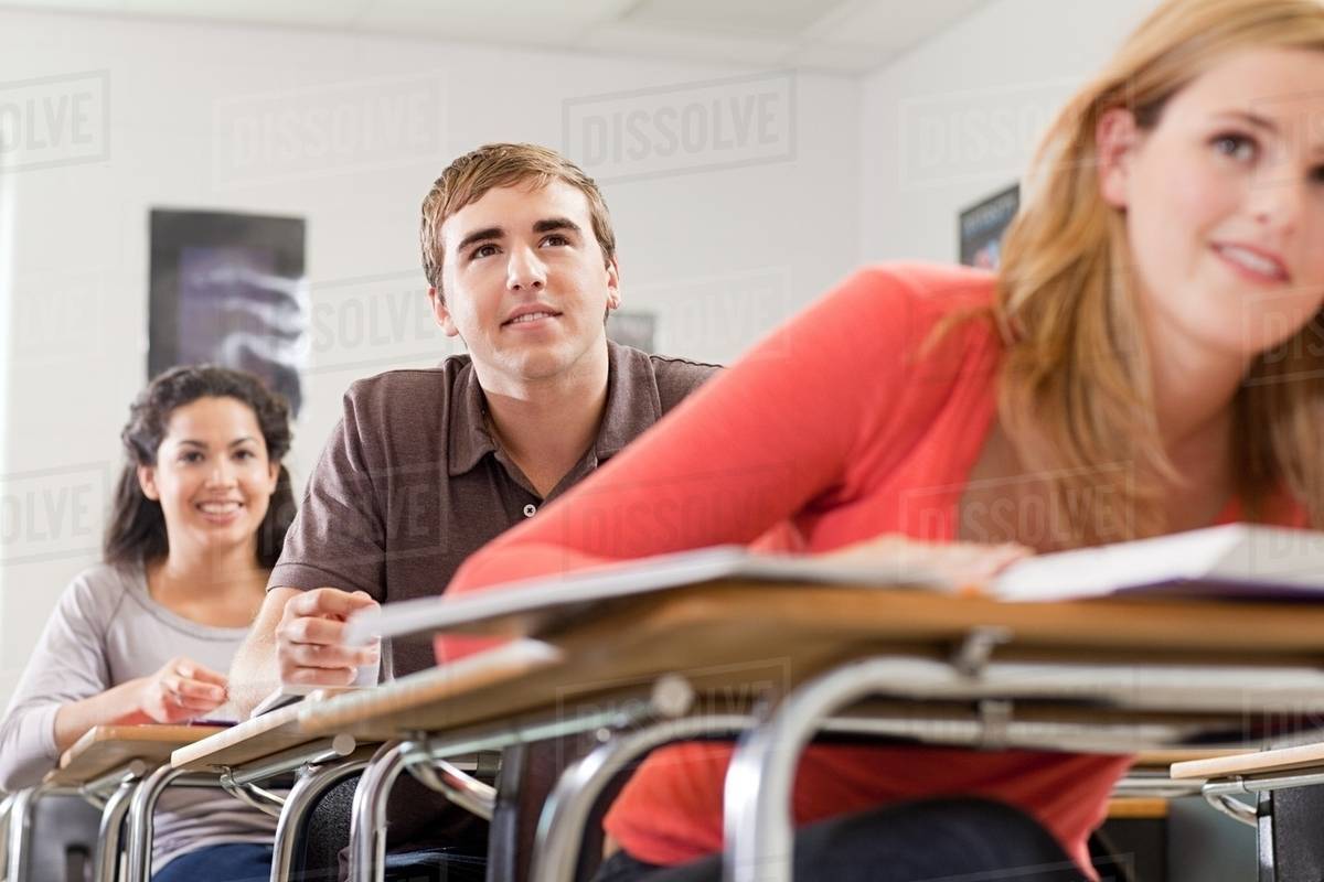 High school students sitting in classroom - Stock Photo - Dissolve