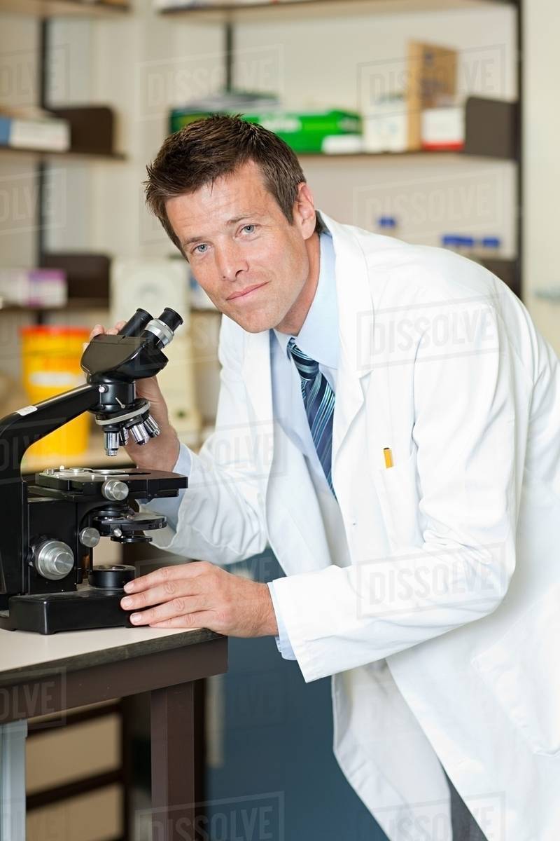 Doctor with microscope - Royalty-free Stock Photo | Dissolve