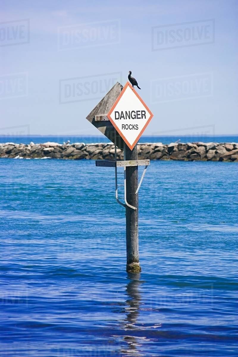 Danger rocks sign in the sea, Montauk, Long Island - Royalty-free Stock ...