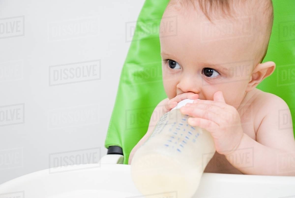 Baby with bottle - Stock Photo - Dissolve