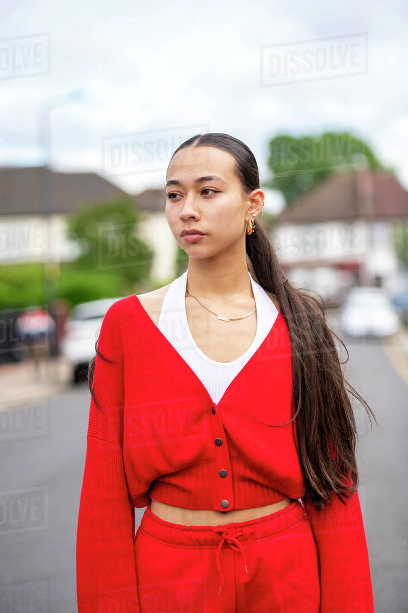 Portrait of woman in red clothing on street, London, UK - Royalty-free ...