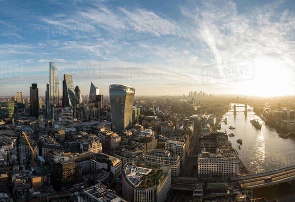 UK, London, Aerial view of financial district skyscrapers at sunset ...