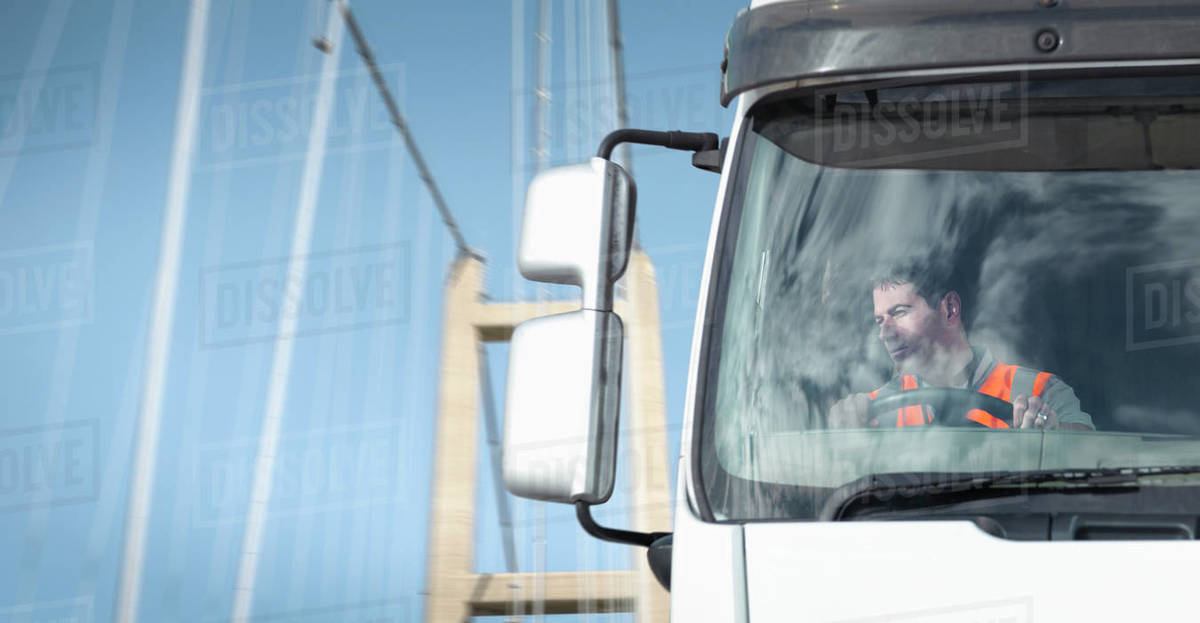Truck driver in truck cabin, UK - Stock Photo - Dissolve