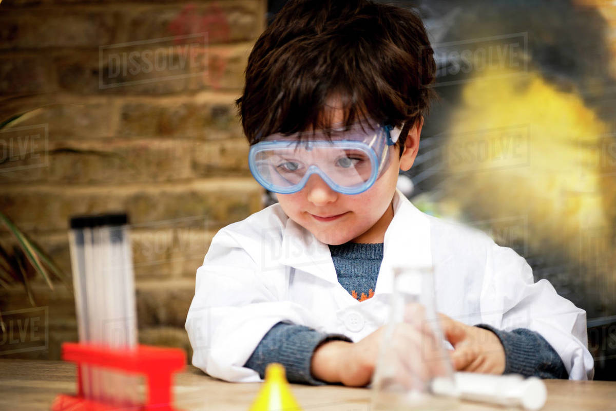Boy making science experiments at home - Royalty-free Stock Photo ...
