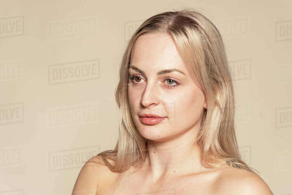 Studio portrait of shirtless young woman - Royalty-free Stock Photo ...