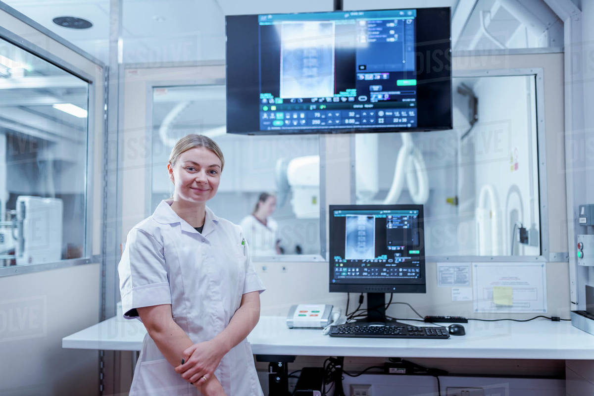 Portrait of radiologist with set up x-ray machine in hospital - Royalty ...