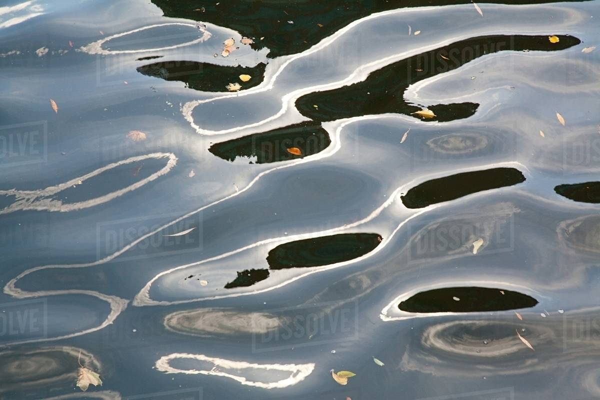 Ripples and reflections on water surface - Royalty-free Stock Photo ...
