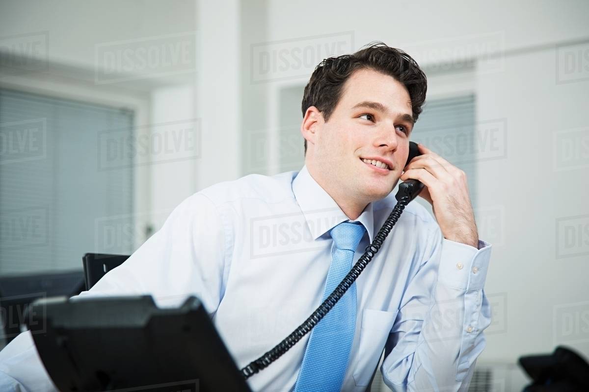 Office worker on telephone call - Royalty-free Stock Photo | Dissolve