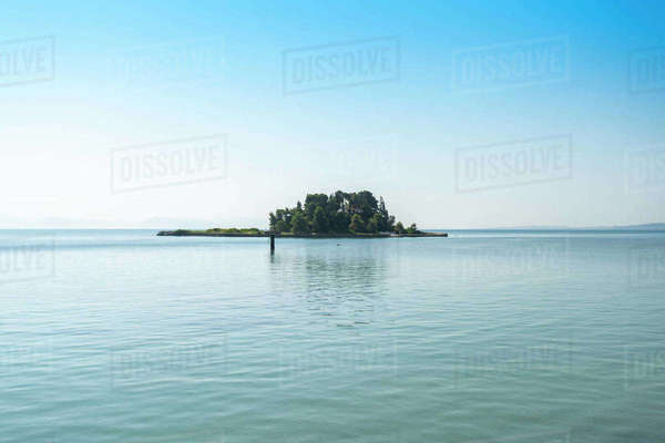 Greece, Pontikonisi islet on calm sea - Stock Photo - Dissolve