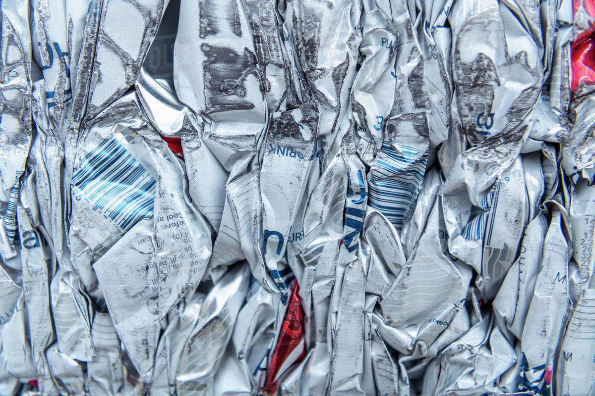 Details of crushed clean cans in aluminum can recycling factory - Stock ...