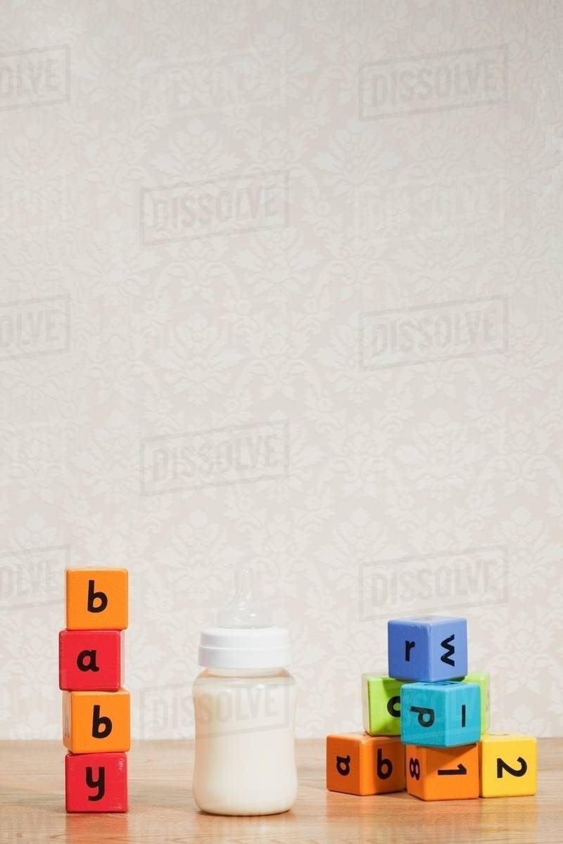 Baby formula and alphabet blocks - Royalty-free Stock Photo | Dissolve
