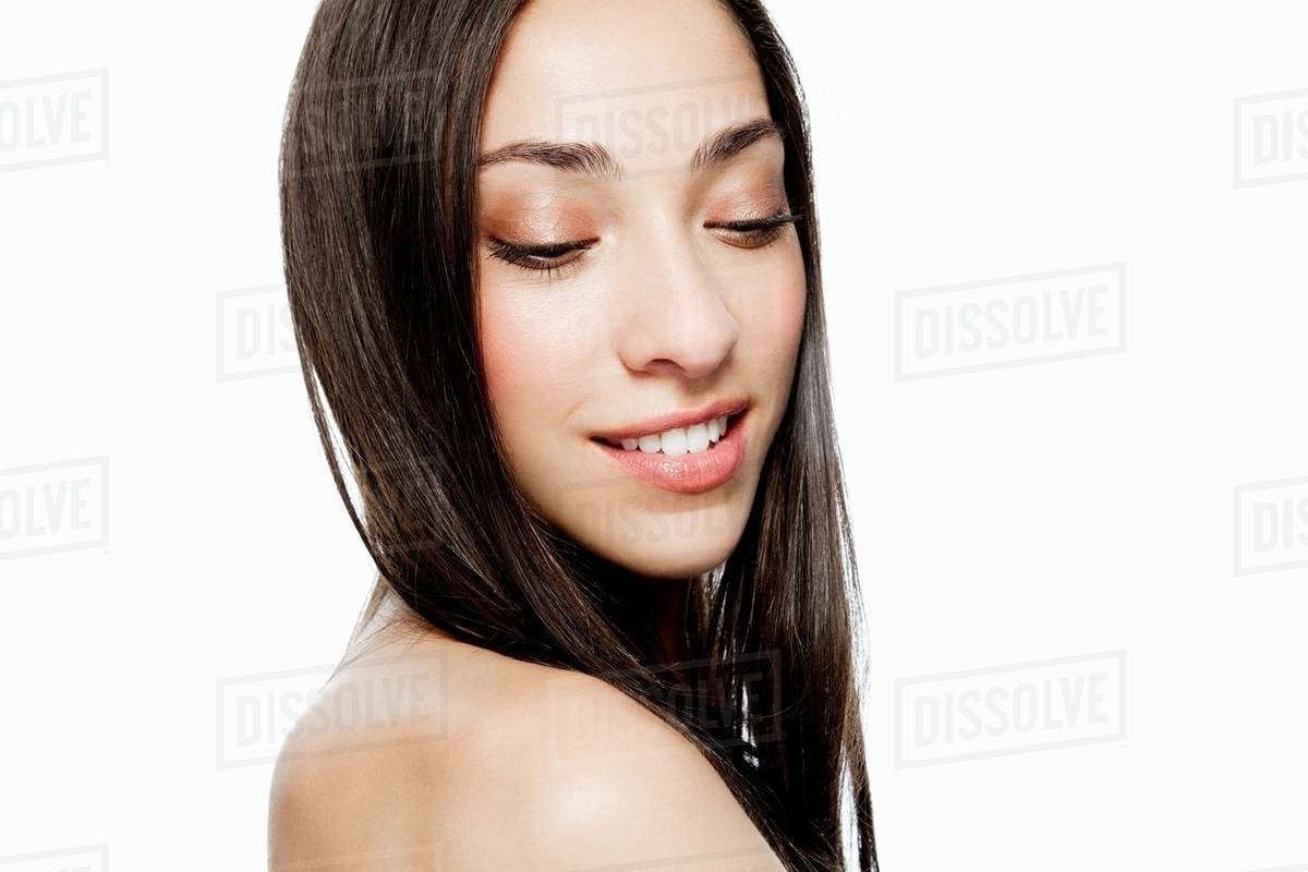 Woman looking down, portrait - Royalty-free Stock Photo | Dissolve