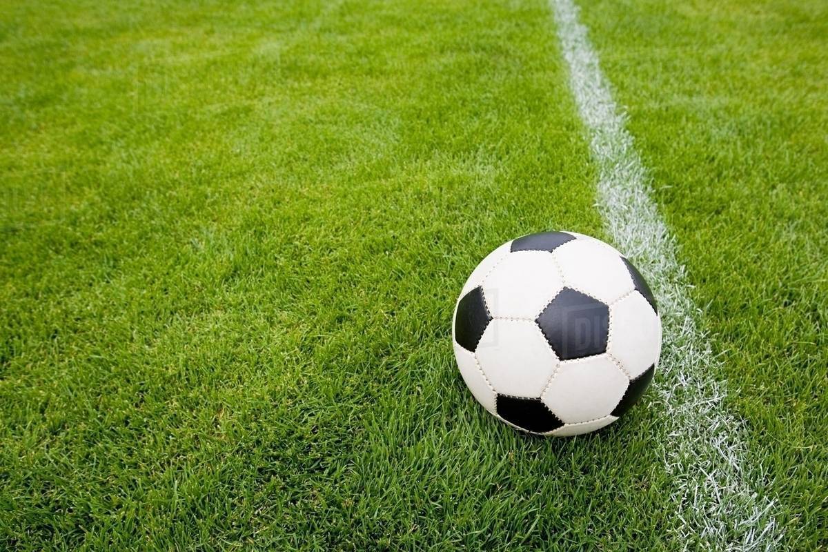 Football on pitch - Royalty-free Stock Photo | Dissolve