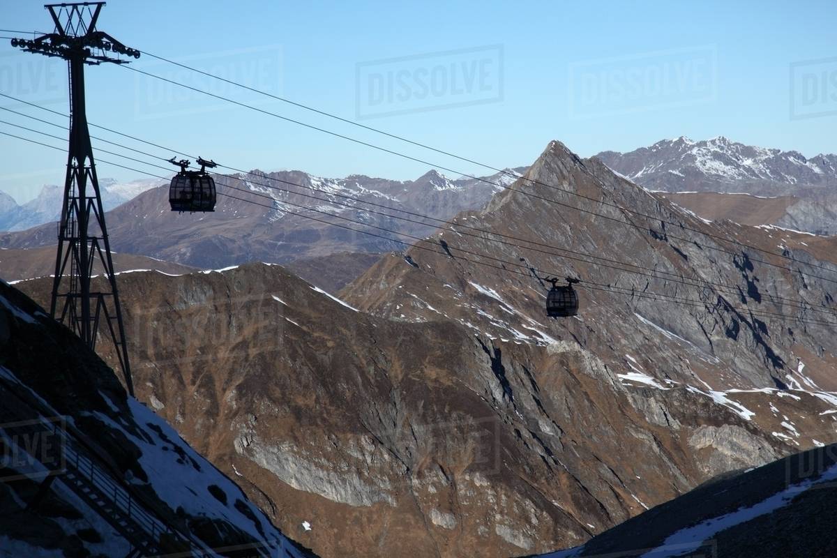 Cable cars over mountains - Royalty-free Stock Photo | Dissolve