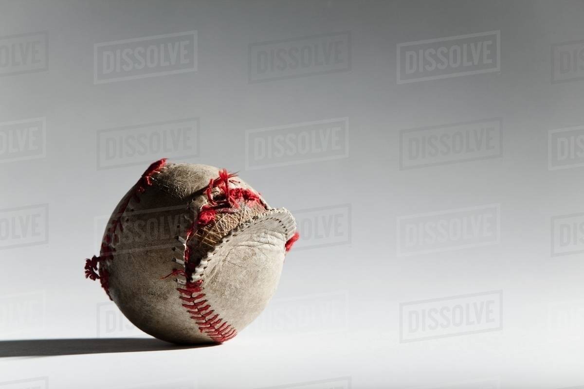 Worn baseball with broken stitching - Royalty-free Stock Photo | Dissolve