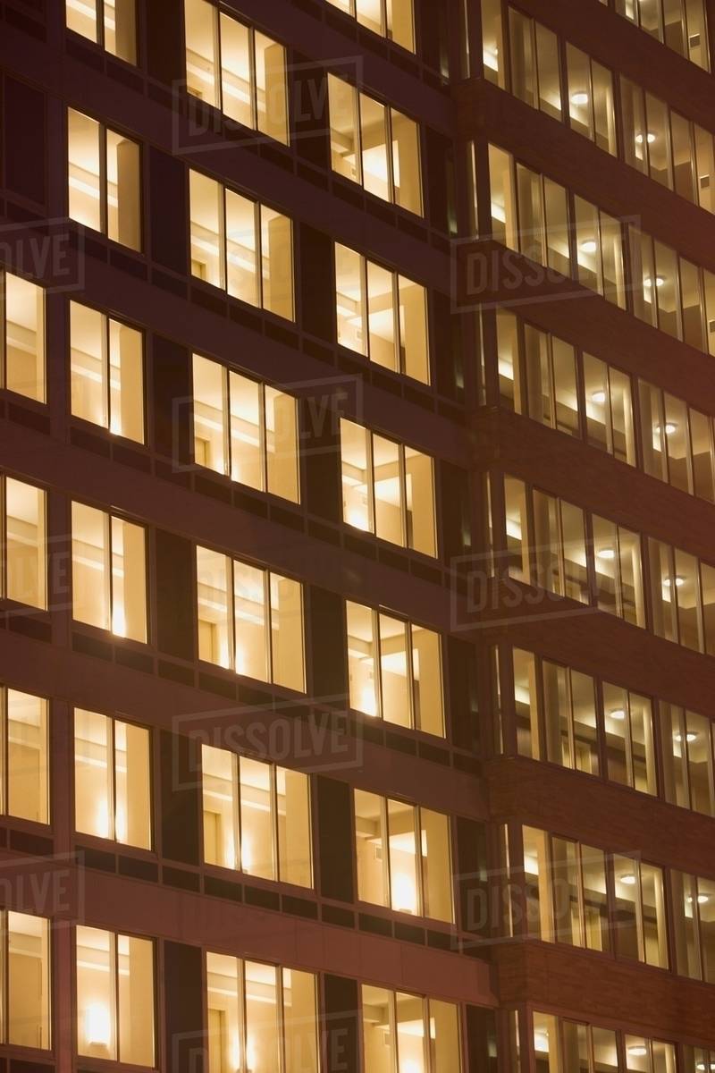 Illuminated windows in office building - Royalty-free Stock Photo ...