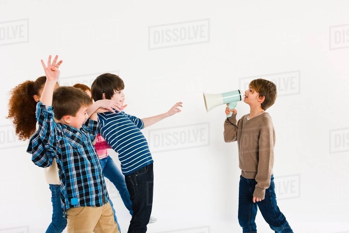Boy with megaphone, shouting at other children - Royalty-free Stock ...