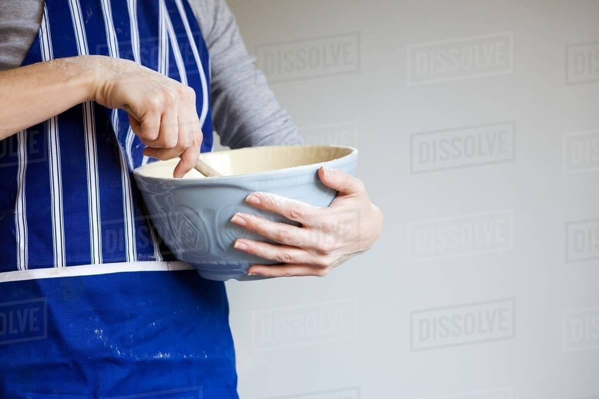 Woman with mixing bowl - Royalty-free Stock Photo | Dissolve