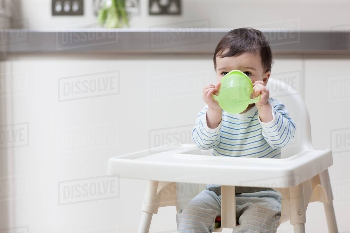 Baby boy drinking - Royalty-free Stock Photo | Dissolve