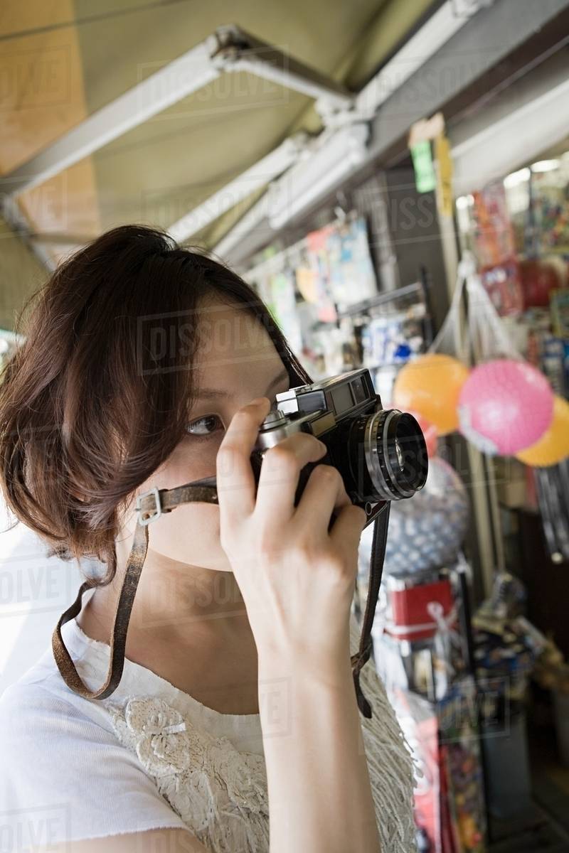 Young woman with camera - Royalty-free Stock Photo | Dissolve
