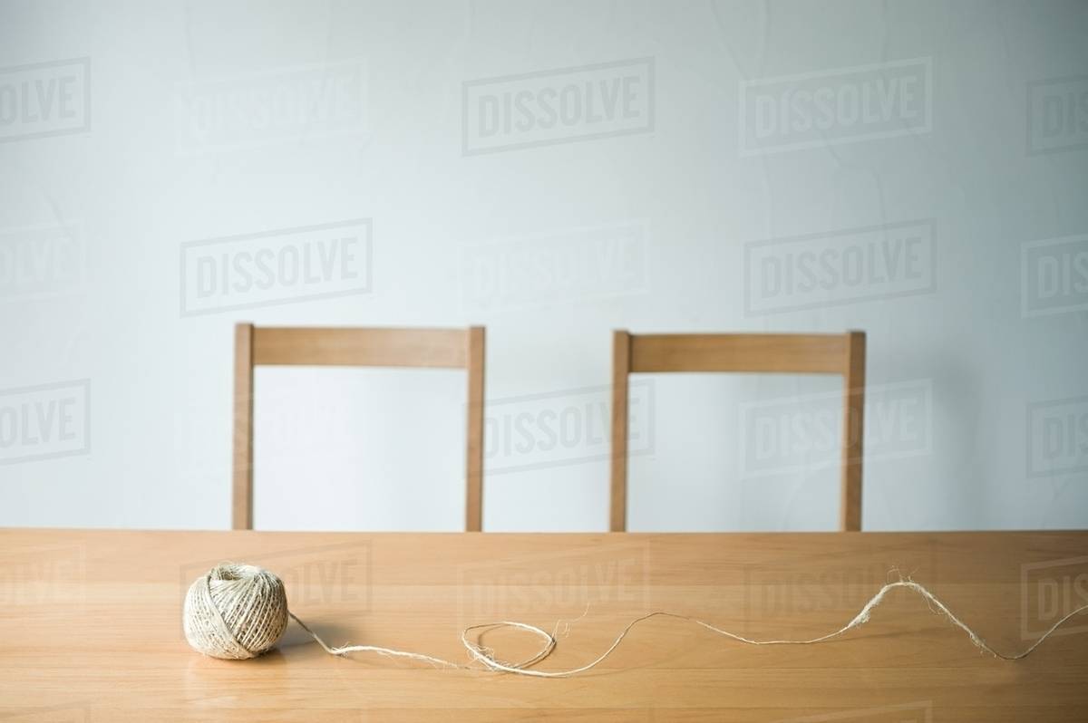 String on a table - Stock Photo - Dissolve