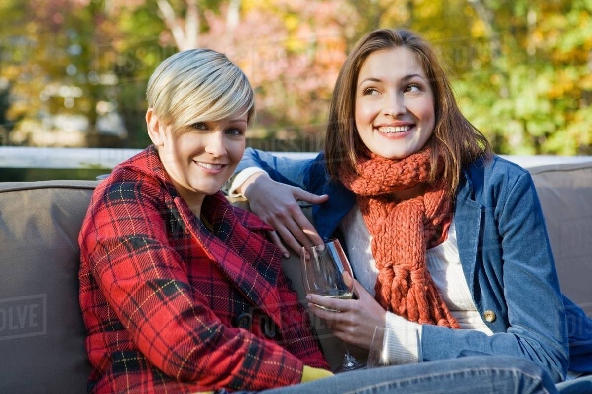 Friends sitting outside - Royalty-free Stock Photo | Dissolve