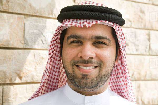 Portrait of a young man wearing a gutra - Royalty-free Stock Photo ...