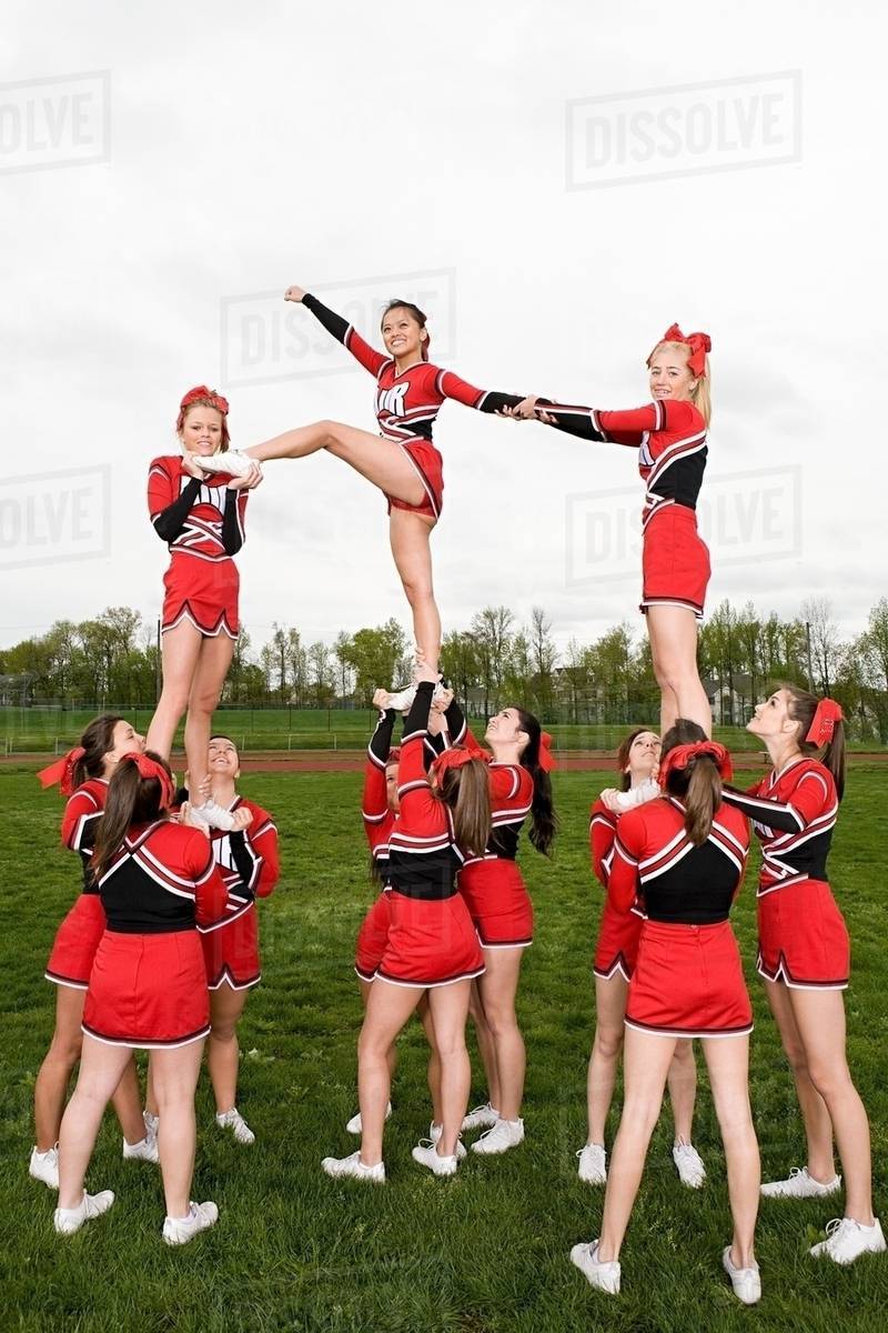 Cheerleaders performing routine - Royalty-free Stock Photo | Dissolve