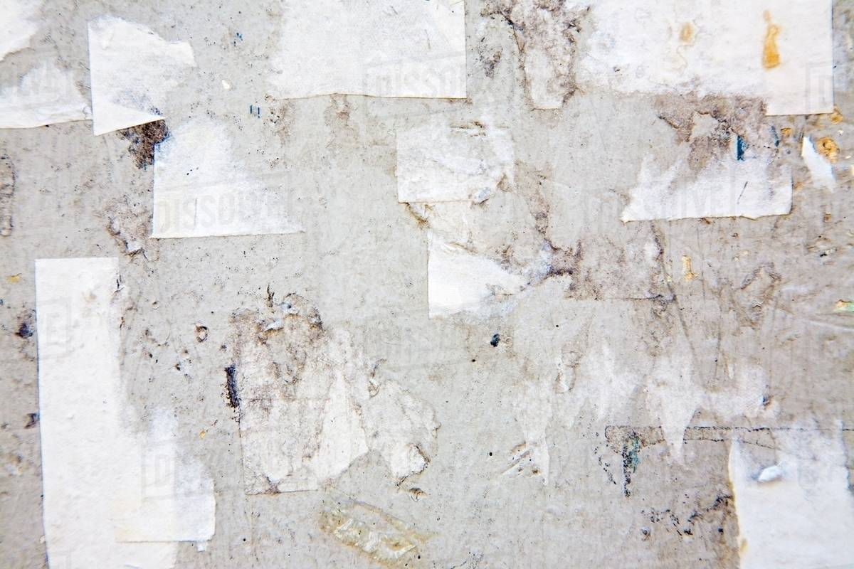 Torn paper on a wall - Royalty-free Stock Photo | Dissolve