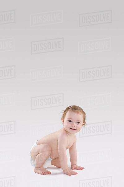 Baby crouching - Royalty-free Stock Photo | Dissolve
