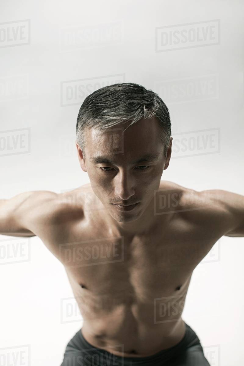 Muscular mature man, front view - Stock Photo - Dissolve