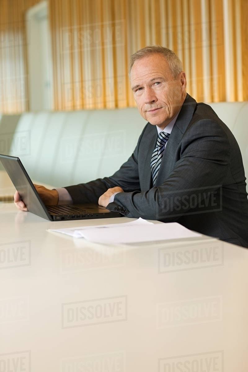 Businessman with laptop - Royalty-free Stock Photo | Dissolve