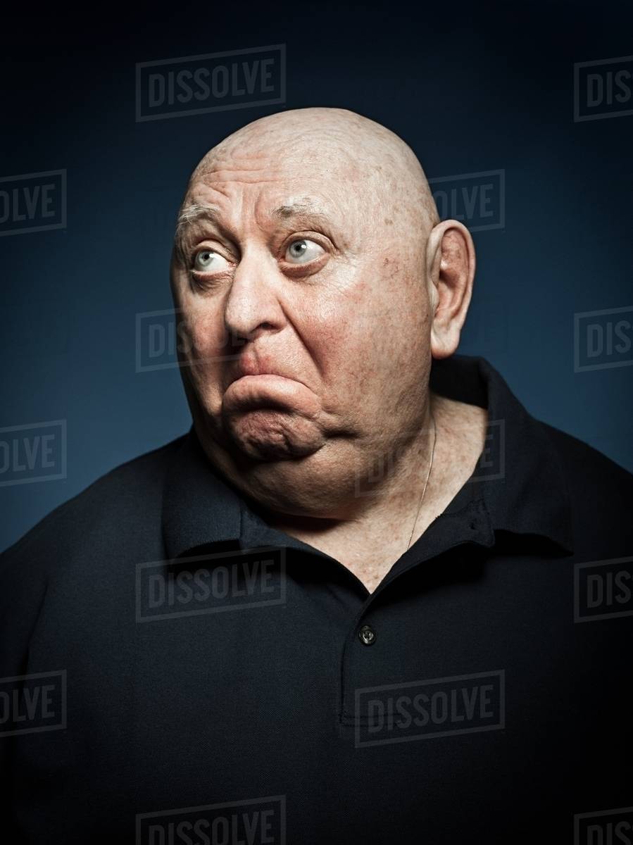 Studio portrait of sad senior man - Stock Photo - Dissolve