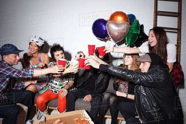 Group of people sitting at party - Royalty-free Stock Photo | Dissolve