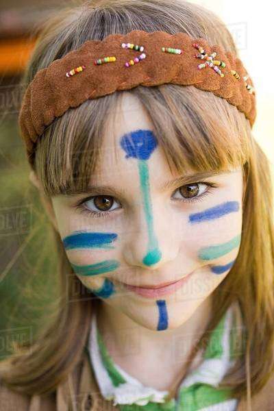 Girl dressed in Native American costume with face painted - Stock Photo ...