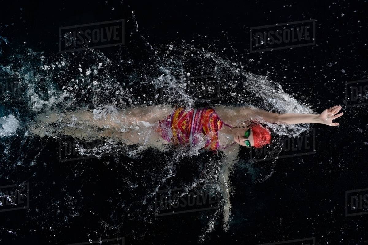 Teenage girl doing backstroke in swimming pool - Royalty-free Stock ...