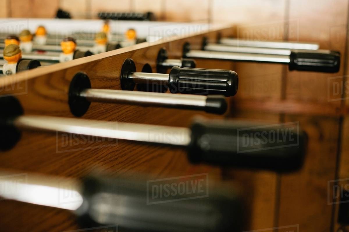 Close up of handles on foosball table - Royalty-free Stock Photo | Dissolve