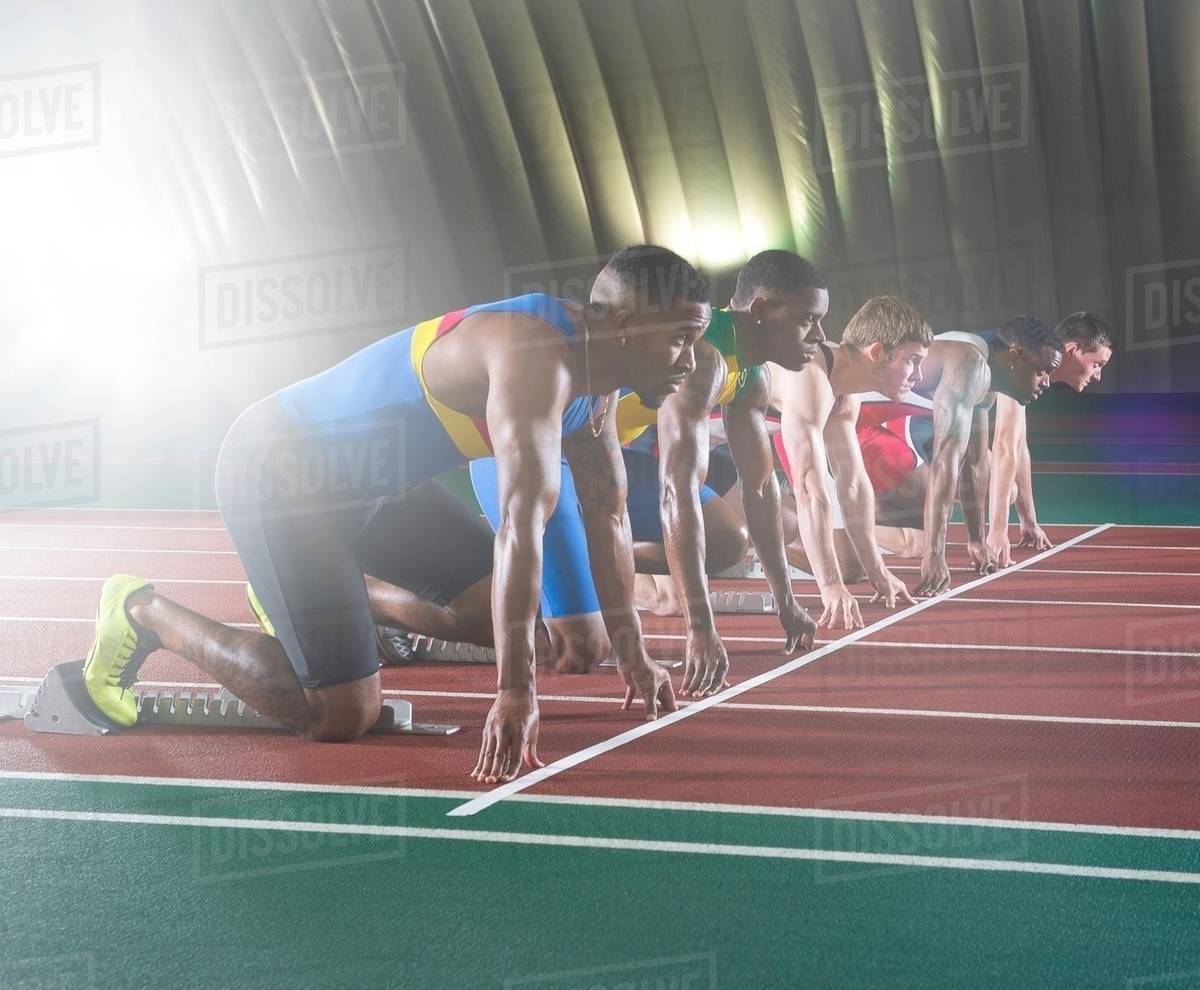 Athletes on start line of race - Stock Photo - Dissolve