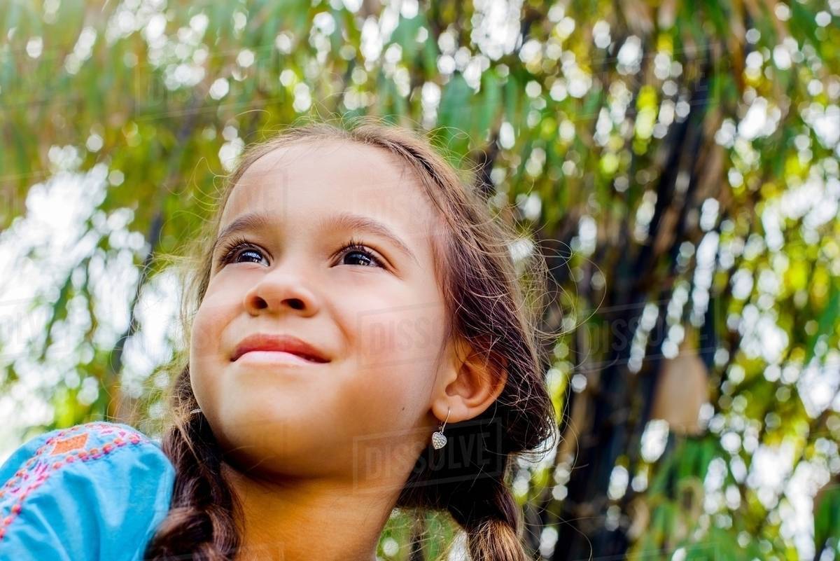 Low angle view of pretty girl in garden - Royalty-free Stock Photo ...